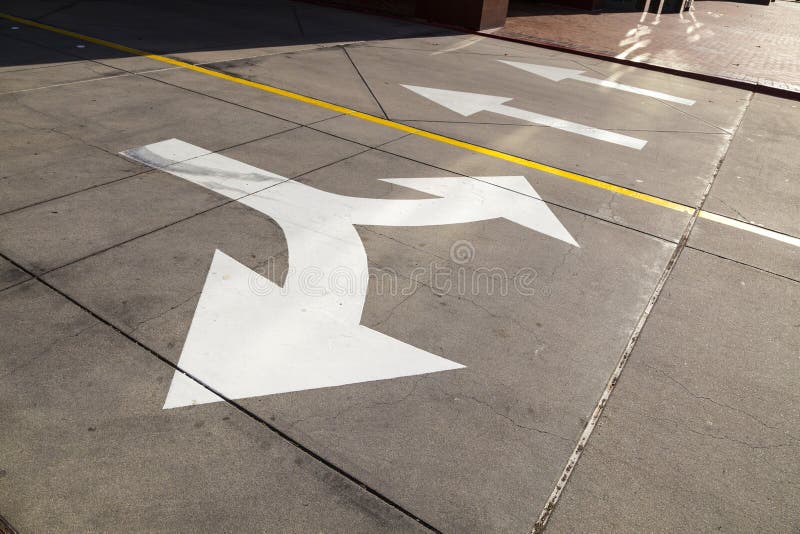 Arrows on the Asphalt To Indicate the Direction of Driving Stock Photo ...