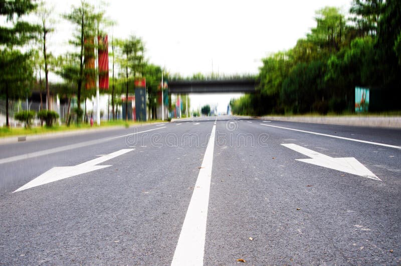 Arrows on the Asphalt To Indicate the Direction of Driving Stock Photo ...