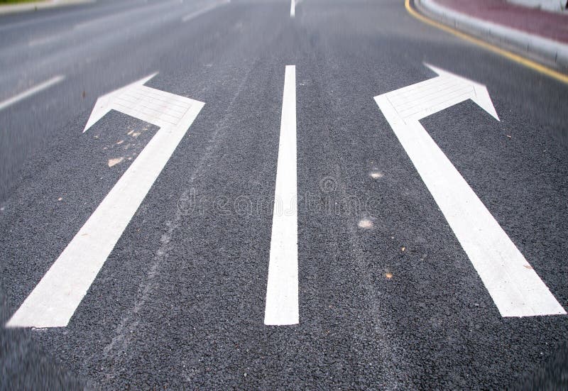 Arrows on the Asphalt To Indicate the Direction of Driving Stock Image ...