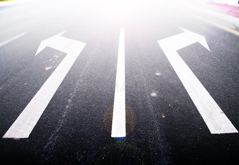 Arrows on the Asphalt To Indicate the Direction of Driving Stock Image ...
