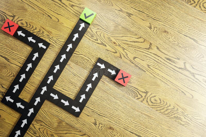 Arrows on a Path with X and Check Marks on Wooden Background, Depicting ...