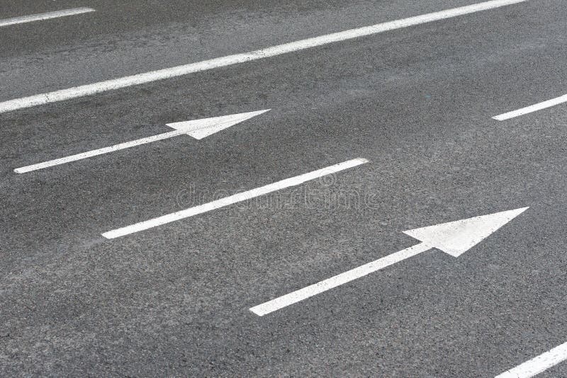 Arrows Signs on an Urban Asphalt Road Stock Image - Image of guide ...