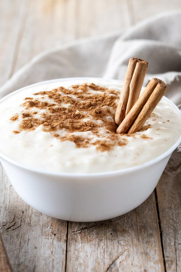 Arroz Con Leche. Rice Pudding with Cinnamon in Bowl on Wooden Table ...