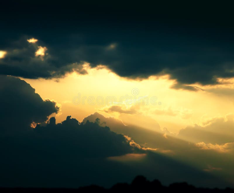 Dramatic Sundown Scene with Dark Clouds and Rays Stock Photo - Image of ...