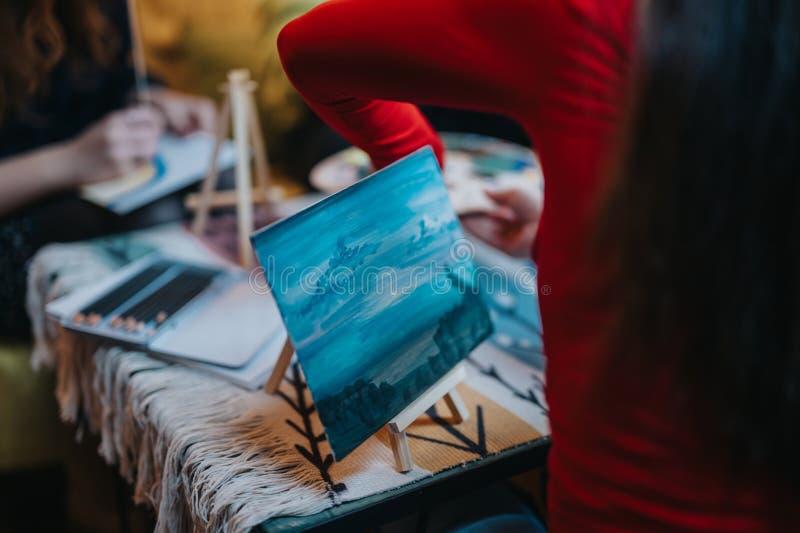 Art Enthusiasts Engaged in Painting Session with Canvas and Materials ...