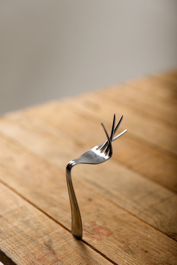 Art of Fork Bending, How To Bend Forks with Your Mind Stock Photo ...