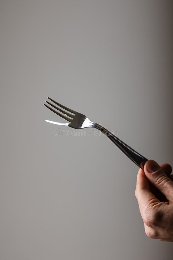 Art of Fork Bending, How To Bend Forks with Your Mind Stock Photo ...