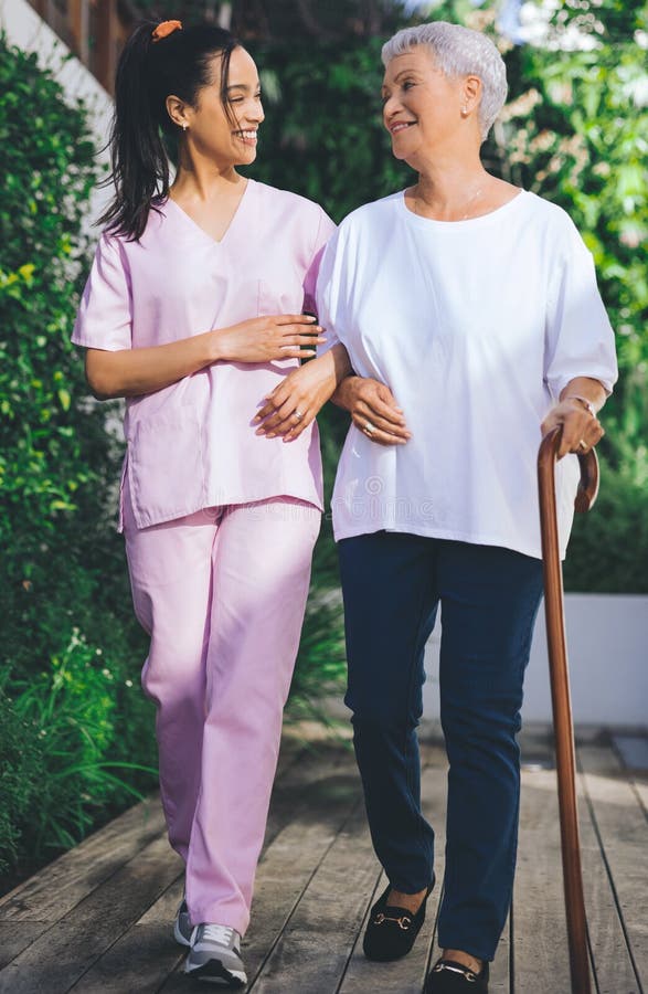 The Art of Getting by. an Older Woman Using a Walking Stick and Walking ...