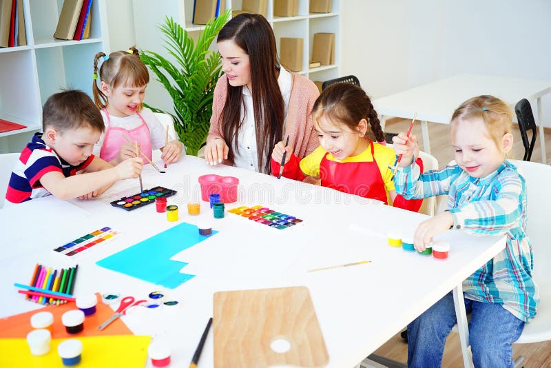 Art lesson in kindergarten stock image. Image of club - 91610437