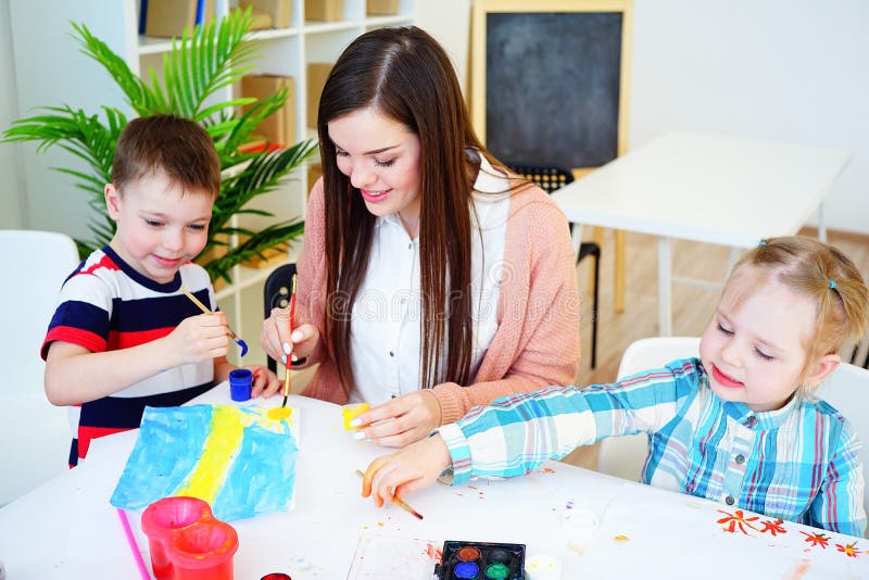 Art lesson in kindergarten stock image. Image of kindergarten - 91955763