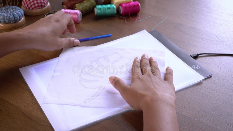 The Art of Pattern Transfer: Using a Lightbox in Embroidery Stock ...