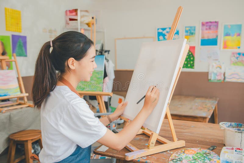 Art Student Drawing with Watercolor Painting on Canvas Doing Some Art ...