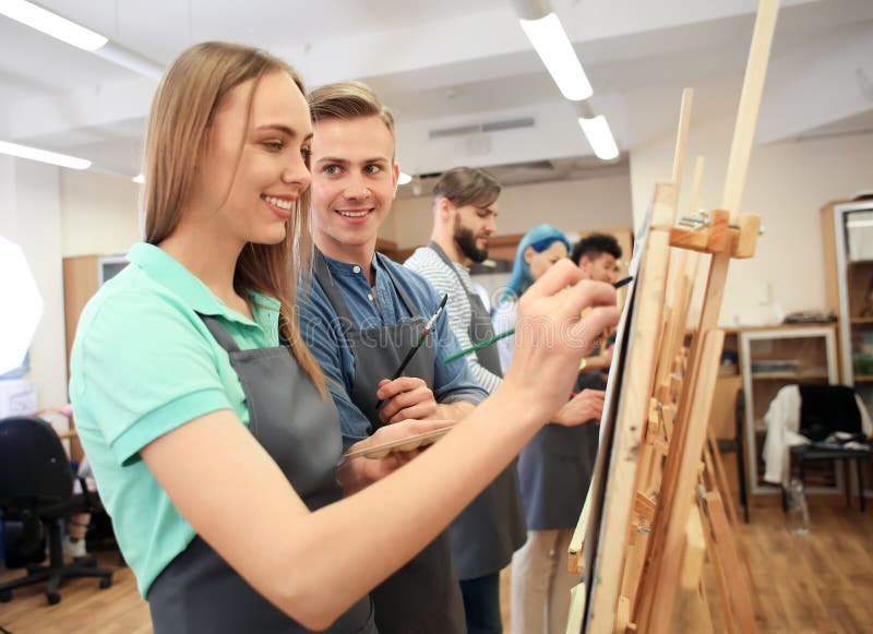 Art Students Painting in Workshop Stock Image - Image of people, apron ...