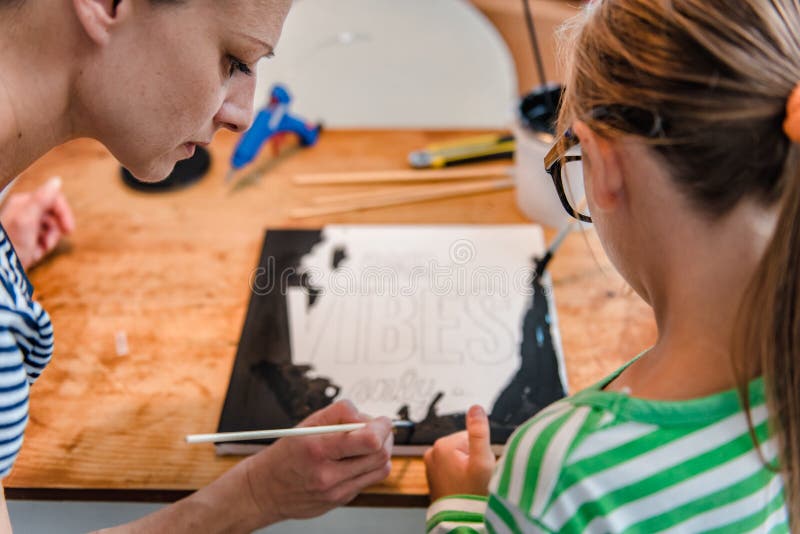 Art Teacher Helping a Student with Painting Stock Photo - Image of copy ...