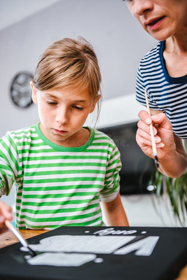 Art Teacher Helping a Student with Painting Stock Image - Image of ...
