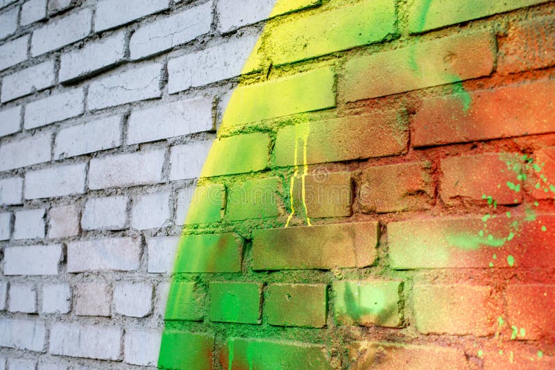 Art Texture: a Brick Wall is Painted with Multi-colored Spray Paints ...