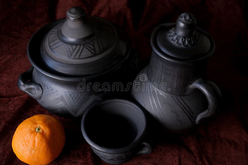 Artfully Crafted Black Pottery with a Citrus Touch in a Soft Setting ...