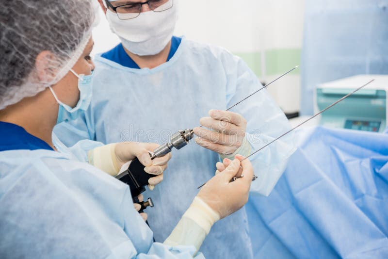 Arthroscope Surgery. Orthopedic Surgeons in Teamwork in the Operating ...