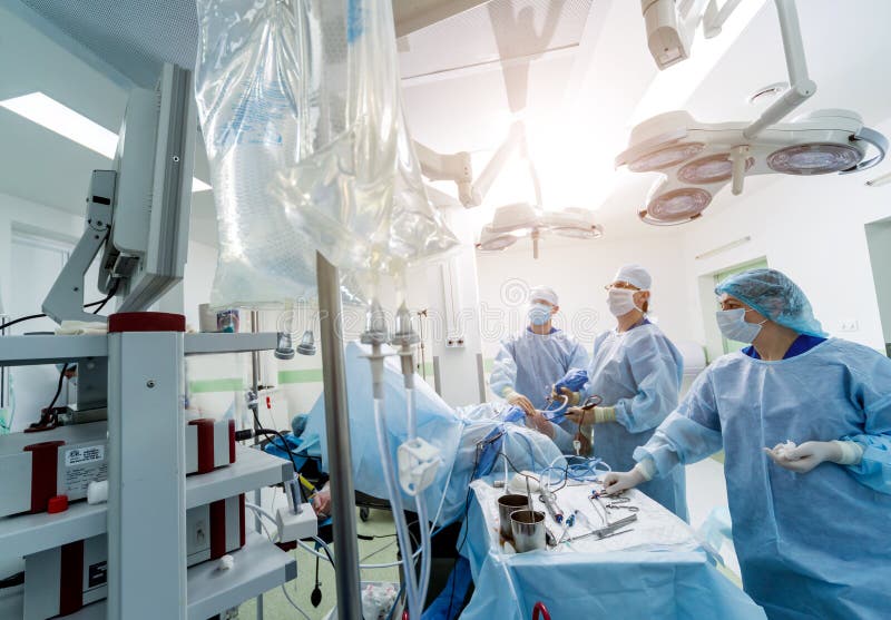 Arthroscope Surgery. Orthopedic Surgeons in Teamwork in the Operating ...