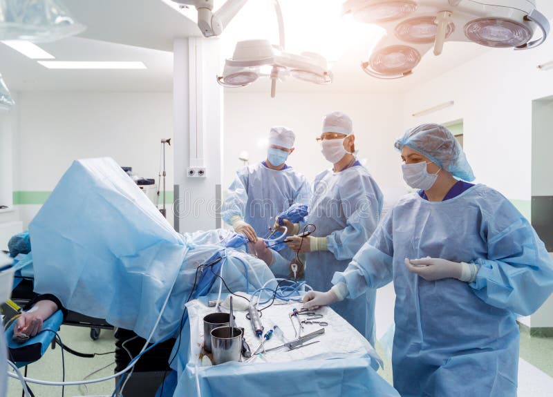 Arthroscope Surgery. Orthopedic Surgeons in Teamwork in the Operating ...