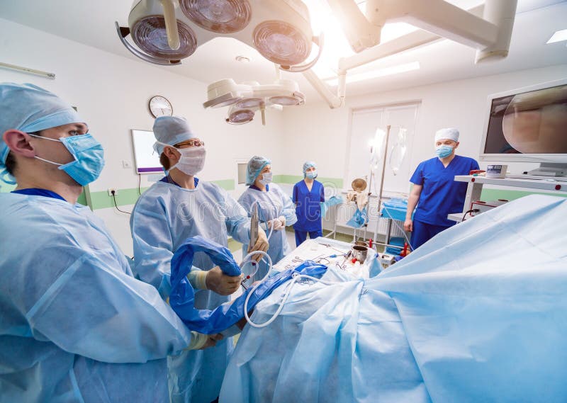 Arthroscope Surgery. Orthopedic Surgeons in Teamwork in the Operating ...