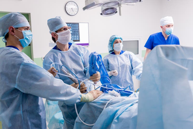 Arthroscope Surgery. Orthopedic Surgeons in Teamwork in the Operating ...