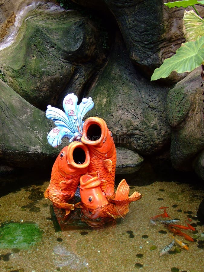 The Artificial Fish and the True Fish Stock Image - Image of contrast ...