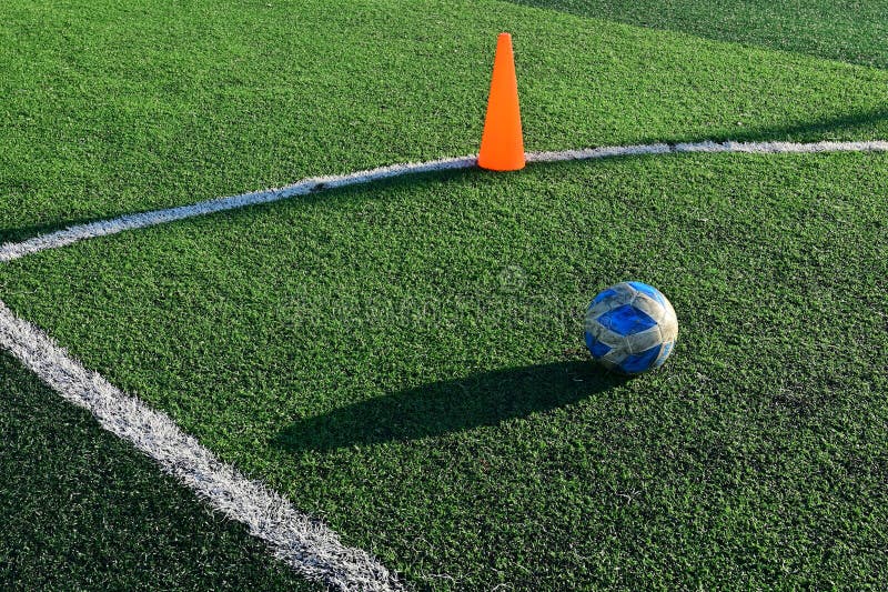 Artificial Green Grass Soccer Field with Training Cone and Ball Stock ...
