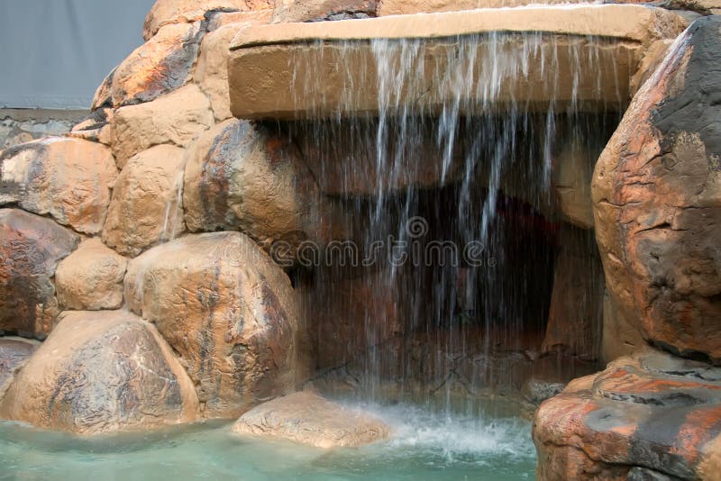 An Artificial Grotto with a Waterfall. Stock Photo - Image of green ...
