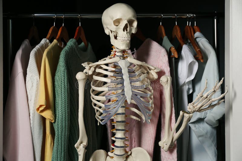 Artificial Human Skeleton Model among Clothes in Wardrobe Stock Photo ...