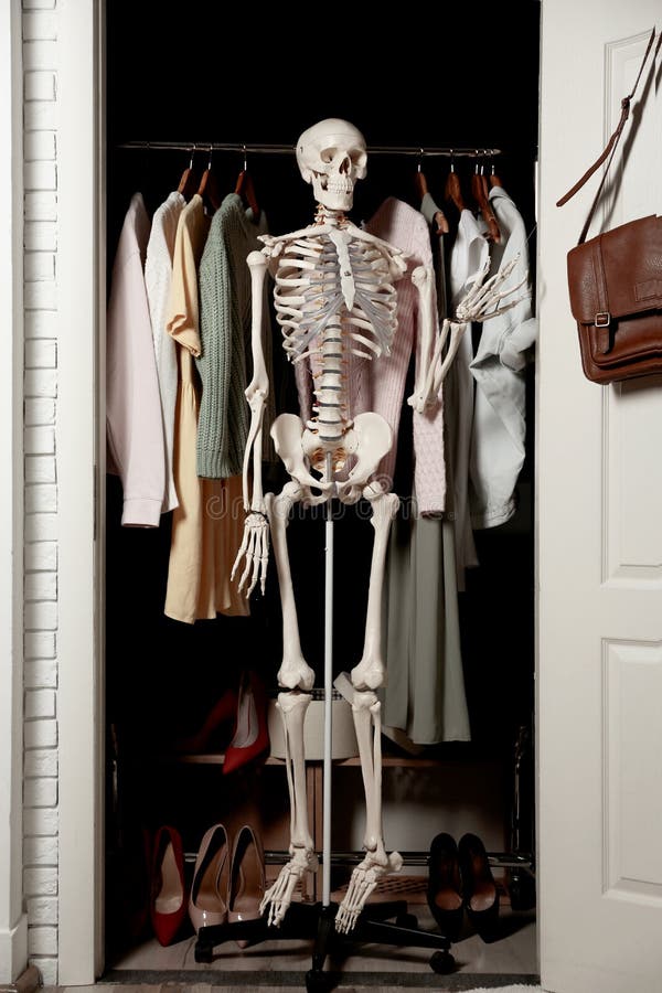 Artificial Human Skeleton Model among Clothes in Wardrobe Stock Image ...