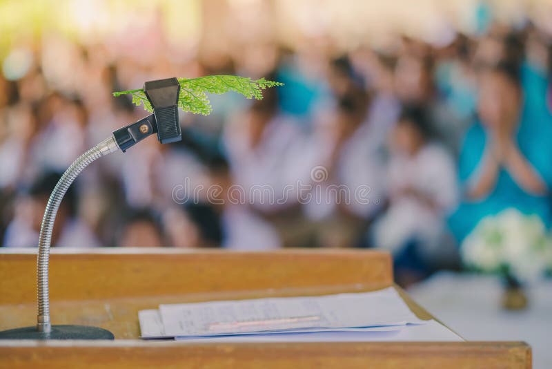 Artificial Leaf Inserted in the Desktop Microphone Stand on Podium in ...