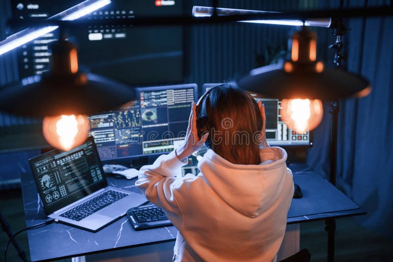 Artificial Lighting. Young Professional Female Hacker is Indoors by ...