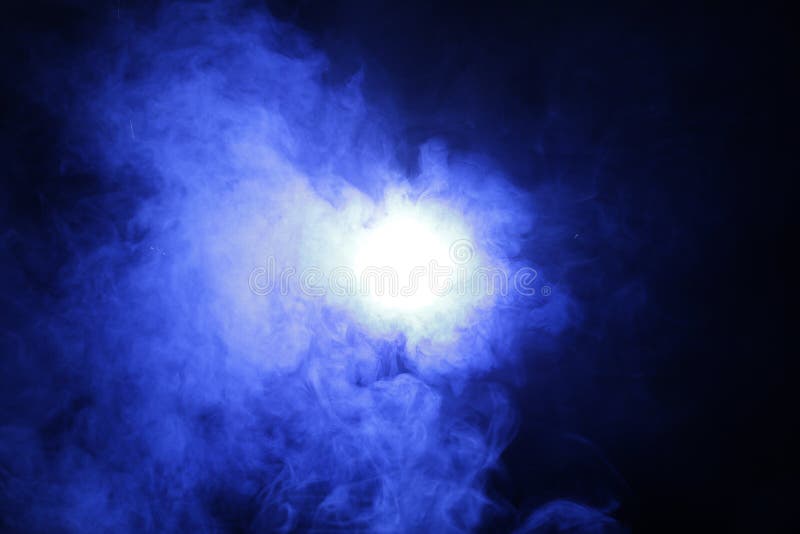 Artificial Magic Smoke in Blue Light on Black Background Stock Image ...