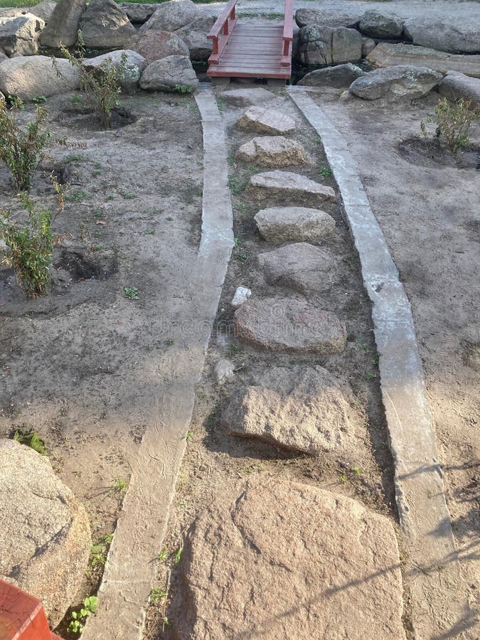 An Artificial Pathway with Irregular Rock Borders, Set Amidst a Wet ...