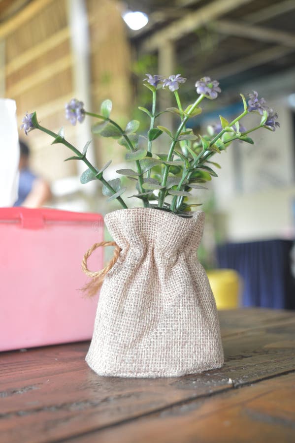 Artificial Plant with Pot Made of Burlap Sack, Cafe Table Interior ...