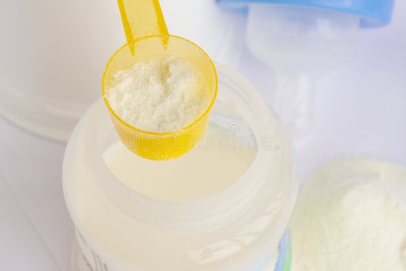 Artificial Powder Milk in a Measuring Plastic Spoon. Stock Image ...