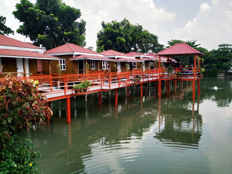 Artificial Red Hut in Pond editorial stock photo. Image of artificial ...