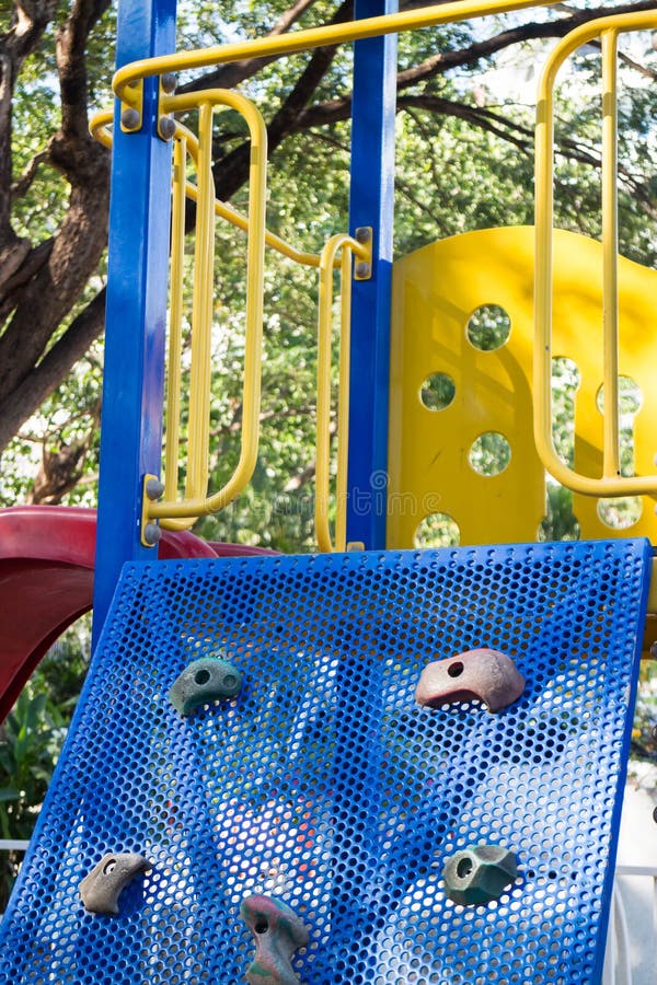 Artificial Rock Climbing Wall at Playground Stock Photo - Image of ...