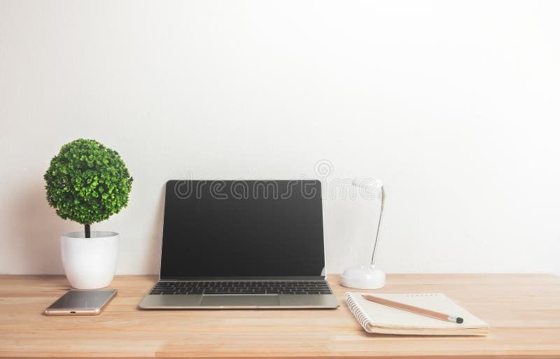 Artificial Tree with Notebook Laptop Mobile Phone and Pencil on Stock ...