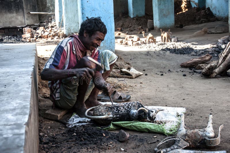 An Artisan Busy with Making Dokra Objects in a Home Workshop in ...
