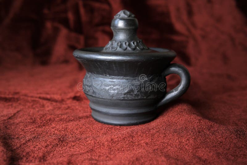 Artisan Crafted Black Pottery on a Rich Textured Backdrop Stock Photo ...