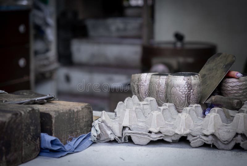 Artisan Crafting Ornate Silver Cups in Traditional Workshop Stock Image ...