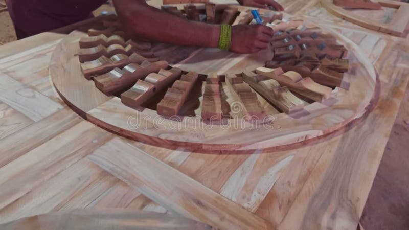 Artisan Crafting a Wooden Wheel Using Traditional Tools in a Workshop ...
