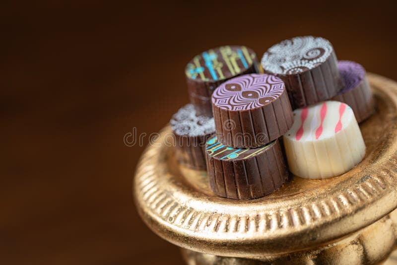 Artisan Fine Chocolate Candy on Gold Pillar Serving Dish Stock Image ...