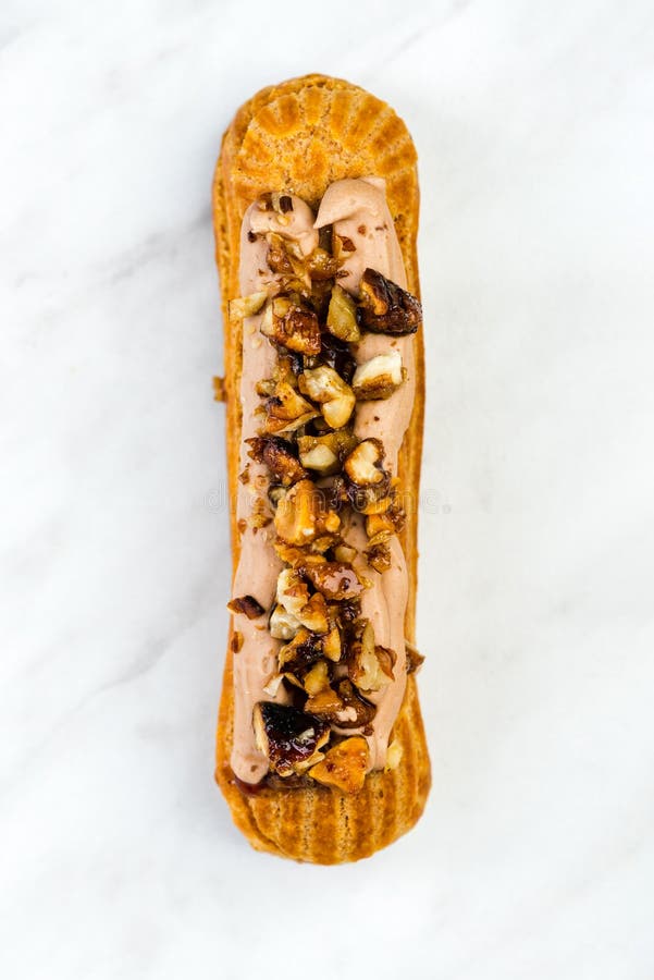 Artisan French Eclair Decorated on White Marble Stock Photo - Image of ...