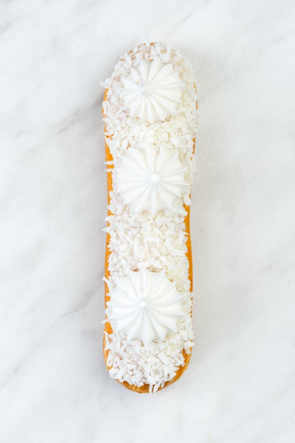 Artisan French Eclair Decorated on White Marble Stock Image - Image of ...