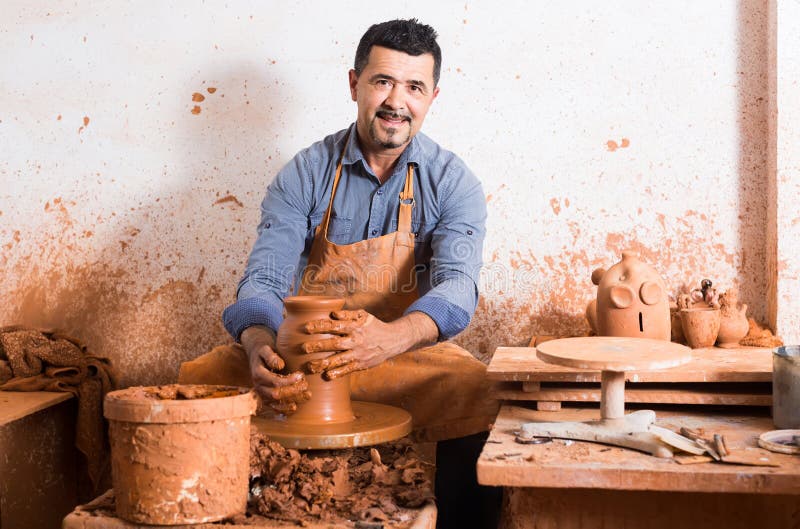 Artisan Man Creating Ceramic Piece on Spinning Pottery Wheel in Stock ...
