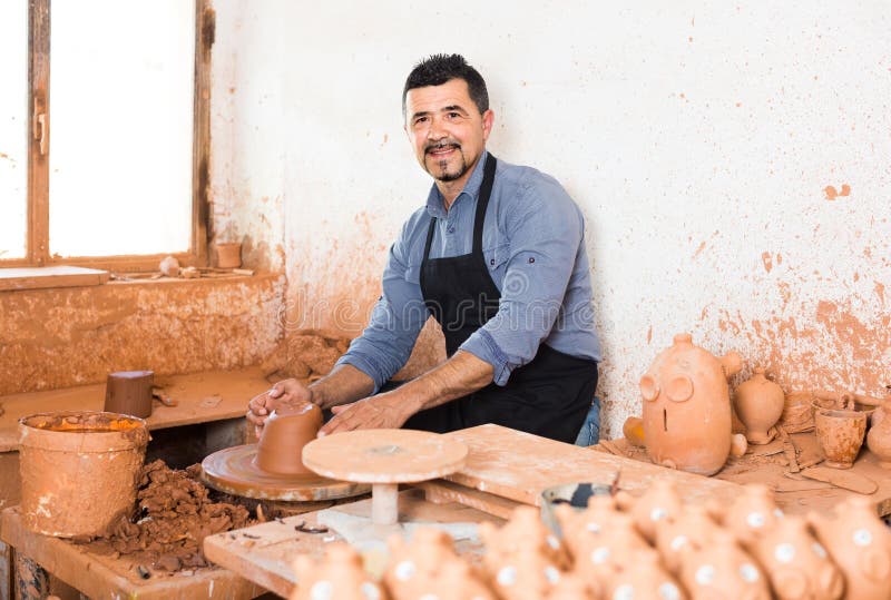 Artisan Man Creating Ceramic Piece on Spinning Pottery Wheel in Stock ...