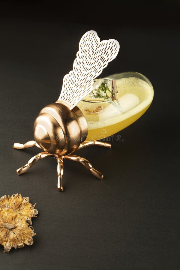 Artisan Orange Mocktail Served in Fancy Bee Shape Container Stock Image ...